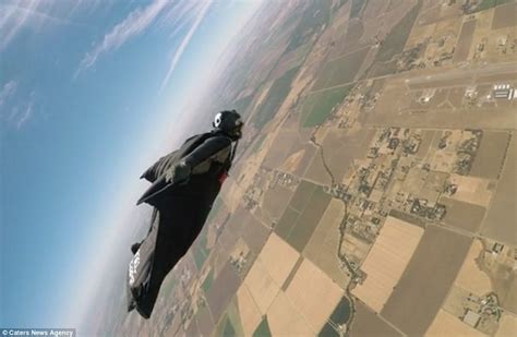 Moment Ex Navy Seal Andy Stumpf Performs Wingsuit Jump For Veterans Day