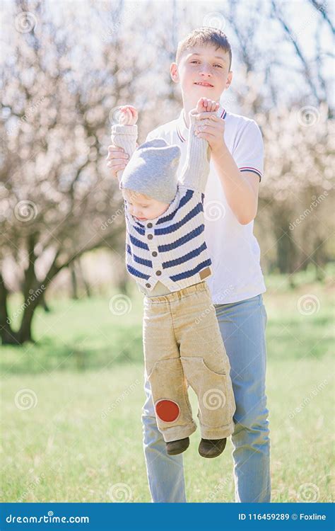 The Elder Brother Plays With The Younger Brother Stock Image Image Of