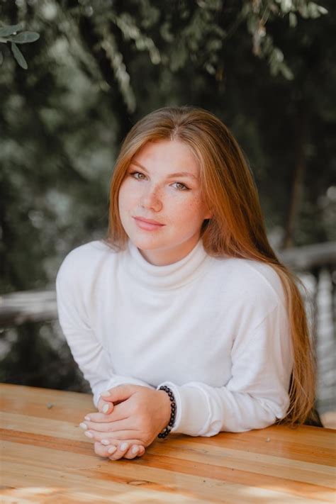 Premium Photo Spanking A Girl With Freckles On Her Face And Long Red Hair