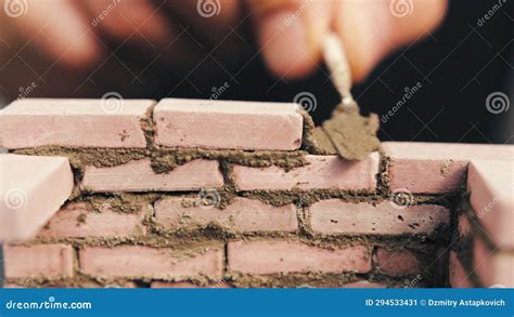 Miniature Brick House Construction With Trowel Tiny Brickwork And Cement Wall Stock Video
