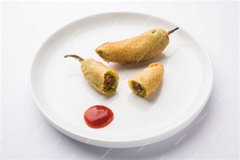 Premium Photo Crispy Green Chilli Pakora Or Mirchi Bajji Served With Tomato Ketchup Its A