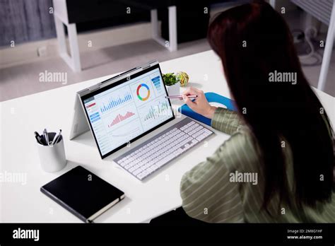 Analyzing Data Graph And Dashboard On Laptop Stock Photo Alamy