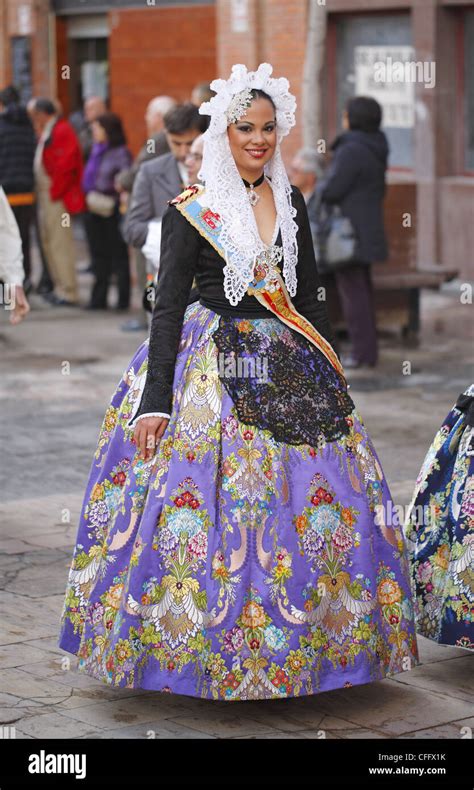 Spanish Woman Wearing Traditional Dress During The Street Procession