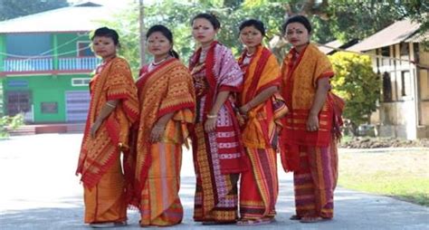 A Group Of Women Wearing Colorful Dressesdescription Automatically