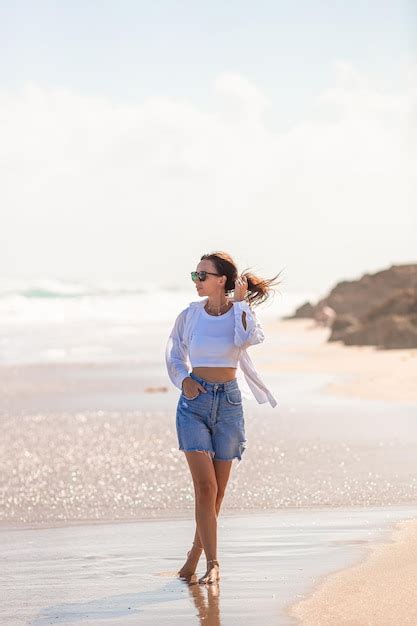 Premium Photo Young Happy Woman On The Beach Enjoy Her Summer