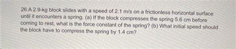 solved 26 a 2 9 kg block slides with a speed of 2 1 m s on