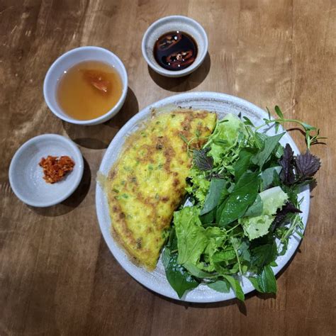 Vietnamese Vegetarian Banh Xeo With Fresh Greens And Sauces Stock Image