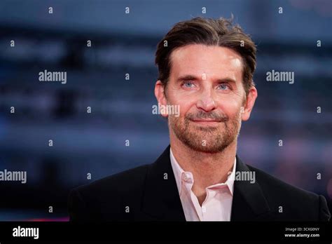 Bradley Cooper Poses For Photographers Upon Arrival At The Premiere Of