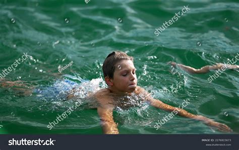 Boy Swimming In Ocean