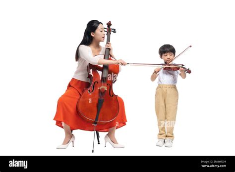 The Female Teacher Guide The Boy Playing Musical Instruments Stock