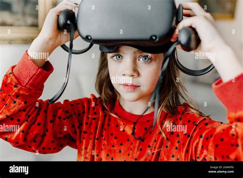 Cute Girl Wearing Virtual Reality Simulator Stock Photo Alamy