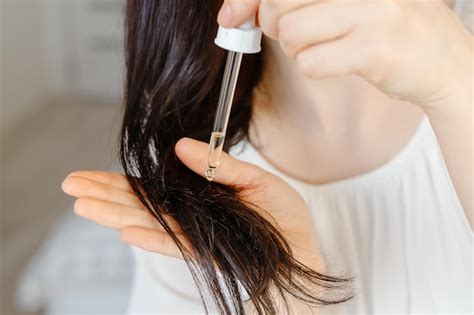 Premium Photo Hair Care Concept Woman Applying Dropper With Oil Or