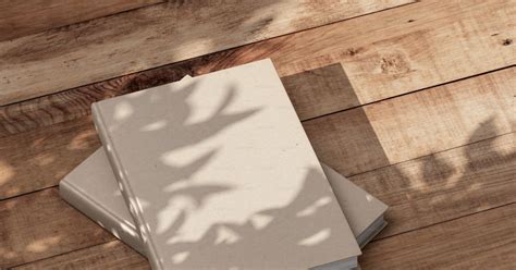 두 권의 책 또는 노트북 야외에서 나무 테이블에 질감이 있는 크래프트 종이 하드커버가 있는 모형 3d 렌더링 사진 Unsplash의 사업 이미지