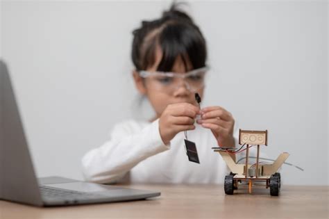 Premium Photo Asia Students Learn At Home In Coding Robot Cars And