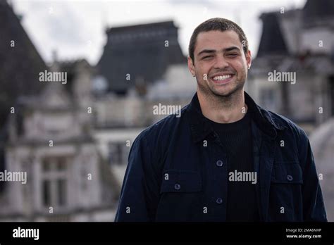 Noah Centineo Poses For Photographers During A Photo Call To Promote