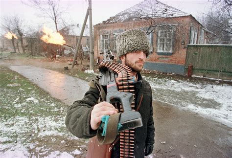 A Chechen Soldier Carries A Pkm In Downtown Grozny On 17 Jan 1995