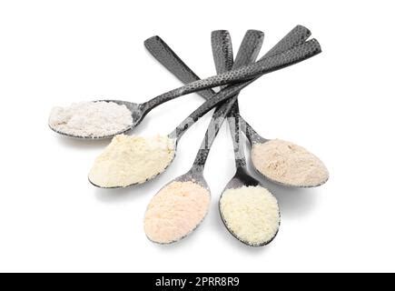 Spoons With Different Types Of Flours On White Background Stock Photo Alamy