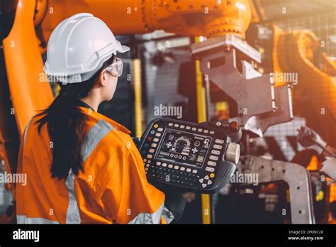 Engineer Team Service Robot Welding Working In Automation Factory Woman Worker Operate Robotic