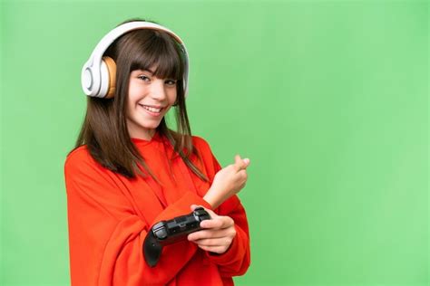 Premium Photo Little Caucasian Girl Playing With A Video Game