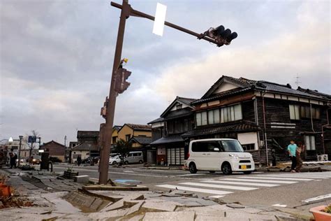 Photos Powerful Earthquake Hits Japan Residents Flee Some Coastal