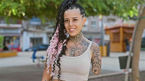 Confident Hispanic Amputee Woman Her Tattooed Arm Smiling Brightly