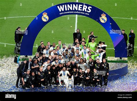 Real Madrid Players And Staff Celebrate After Winning The Uefa