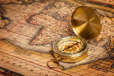 Premium Photo Old Vintage Golden Compass On Ancient Map
