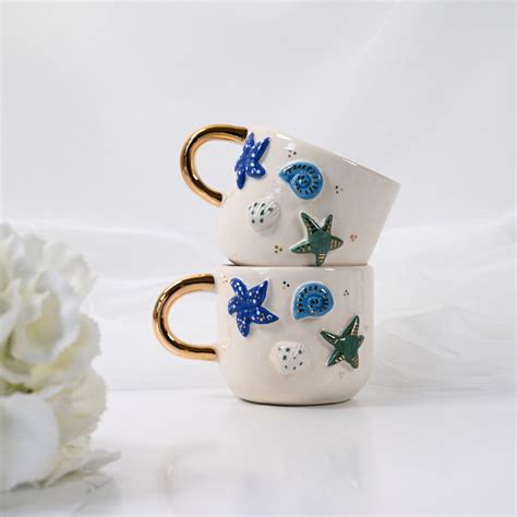 Skodelica Cici Shells 24k Zlatoandročno Delo Flora Zelišča