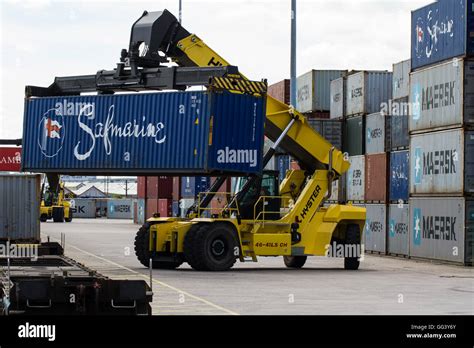 a heavy lifting machine unloading and loading cargo and shipping