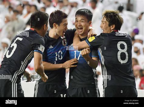 Japans Yasuyuki Konno 17 Is Surrounded By His Teammates After