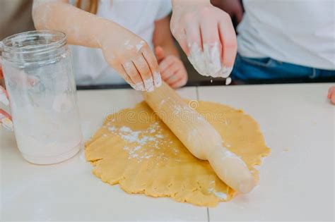 Mom Teaches Her Daughters To Cook Dough In The Kitchen Stock Photo Image Of Mother Person