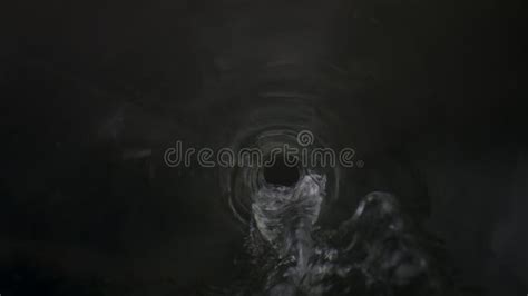 Water Flowing Inside Bottle Close Up Swirling Liquid Falling Down To