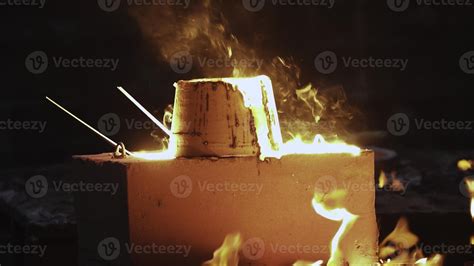 Metal Casting Process Involves The Pouring Of Molten Steel Into Molds For Shaping Objects Stock