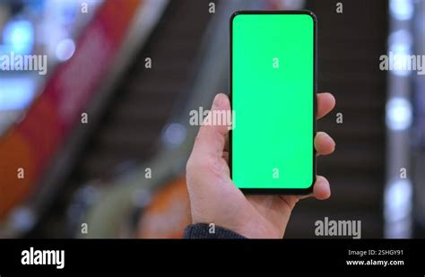 Mall. Use green screen for copy space closeup. Chroma key mock-up on smartphone Stock Video ...