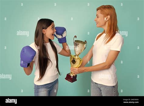 Mother And Teen Daughter Wearing Boxing Gloves Emotional Excited And