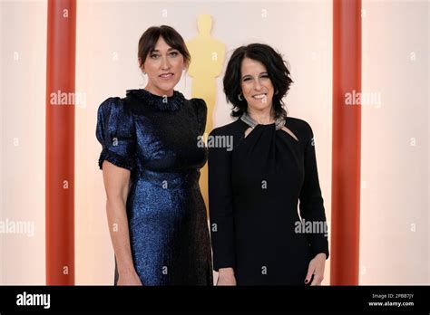 Beth Levison Left And Annie Alvergue Arrive At The Oscars On Sunday March 12 2023 At The