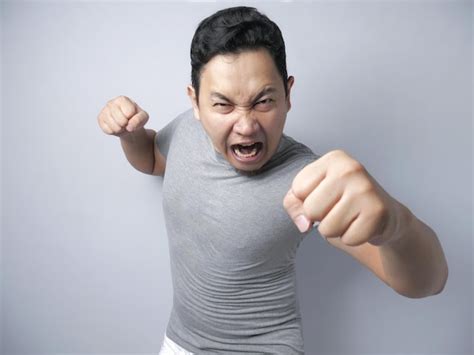 Premium Photo Funny Asian Man Showing Angry Face Putting Up His Fist