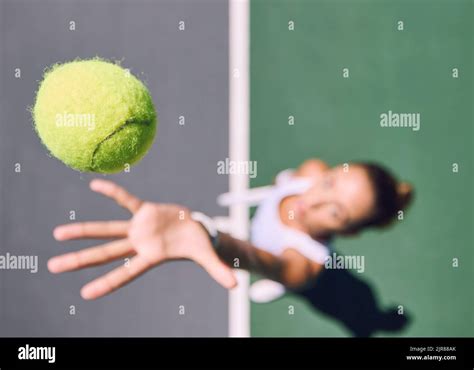 Tennis Ball Sports And Female Player Throwing And Serving On A Court