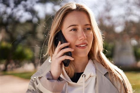Premium Photo Joyful Young Caucasian Woman Talking On Phone