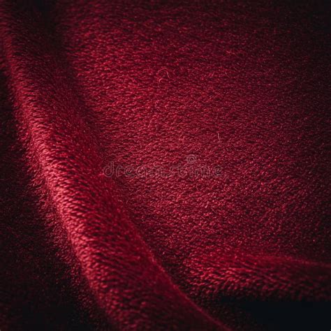 A Close Up View Of Deep Red Fabric With A Soft Plush Texture The