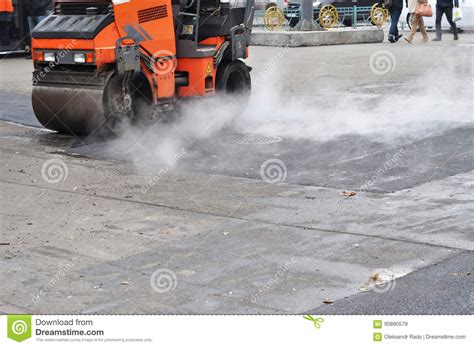 Road Repair Compactor Lays Asphalt Roadworks On Laying Of A Sphalt Stock Image Image Of