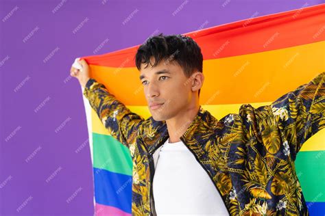 Premium Photo Happy Biracial Man Holding Lgbt Rainbow Flag And
