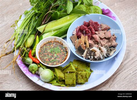 Raw Meat Beef Slide With Spicy Sauce And Fresh Vegetable On Tray Asian