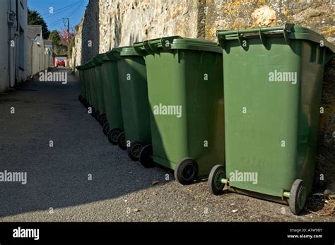 A Row Of Green Wheelie Bins Ready For Rubbish Collection In Cornwall