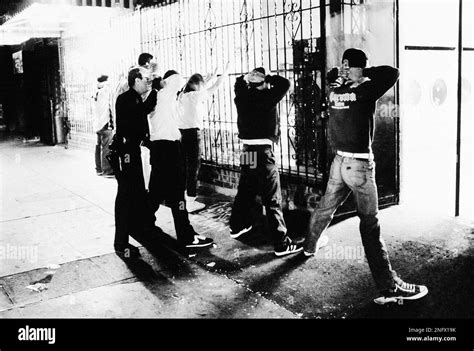 A Los Angeles Police Officer Searches Members Of The 18th Street Gang