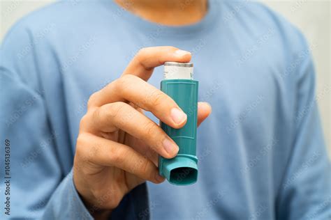 Asthma And Chronic Obstructive Pulmonary Disease Copd Asian Young Man Using Metered Dose