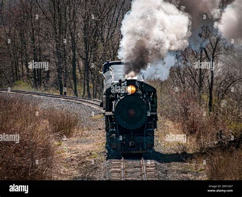 A Head On And Above View Of An Approaching Restored Narrow Gauge