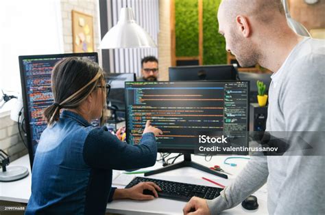 Software Programmers Analyzing Html Code And Database Brainstorming Script Ideas To Develop New