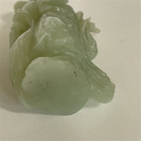 Light Green Jade Chinese Geisha Figurine Holding Rose And Feathers In