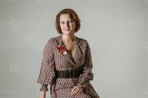 Mature Woman Posing In The Studio In The Background 13128613 Stock